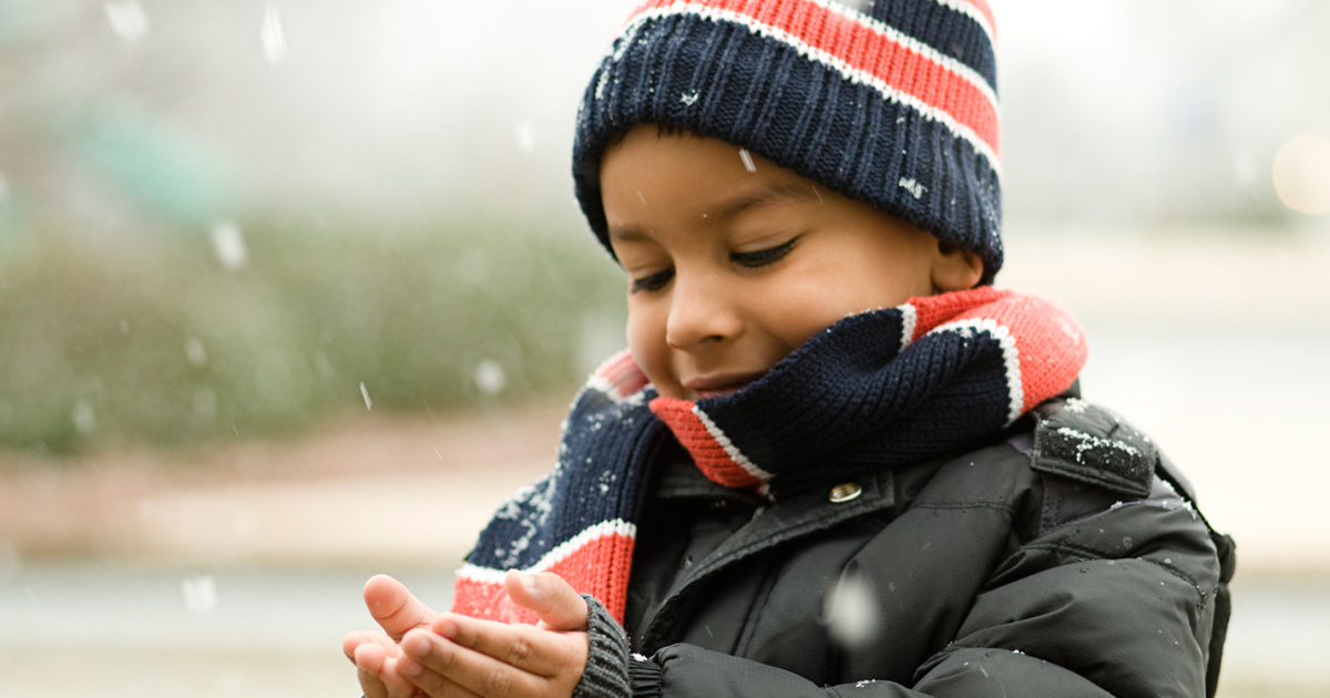 kid putting on jacket